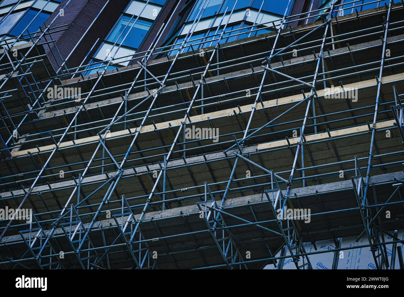Scaffolding on a building facade, construction and renovation concept ...