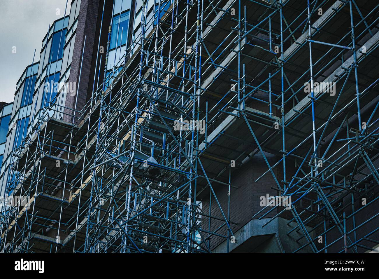 Complex network of metal scaffolding on the exterior of a modern ...