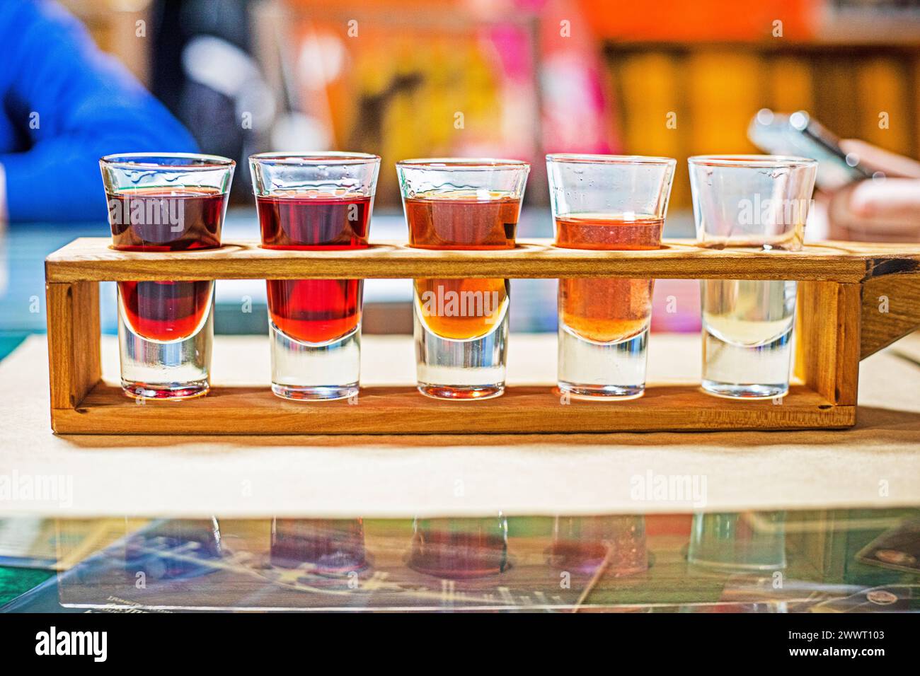 tasting of berry liqueurs. Making homemade tinctures and liqueurs Stock ...