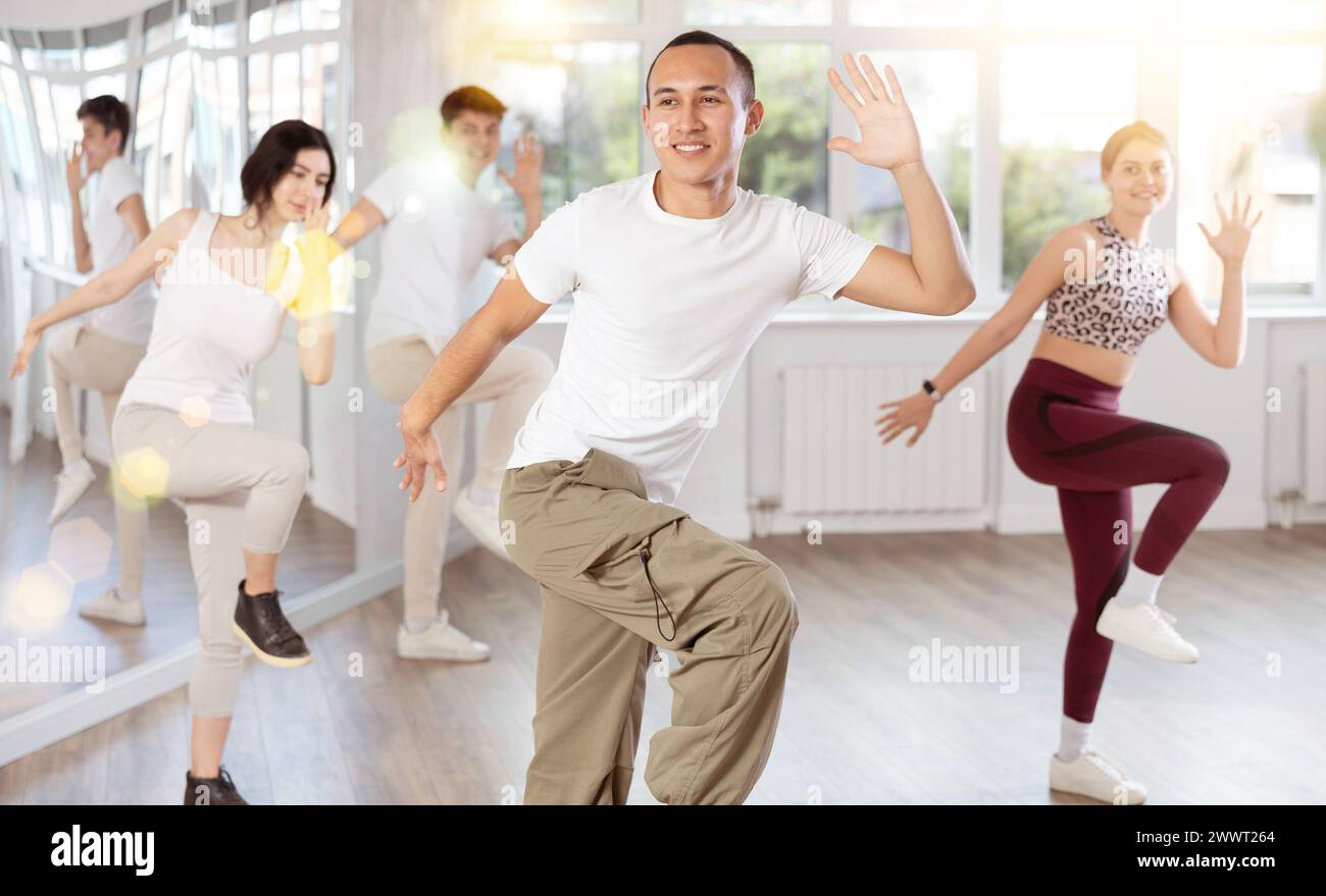 Guy enjoys active dancing, learns new movements, moves synchronously ...