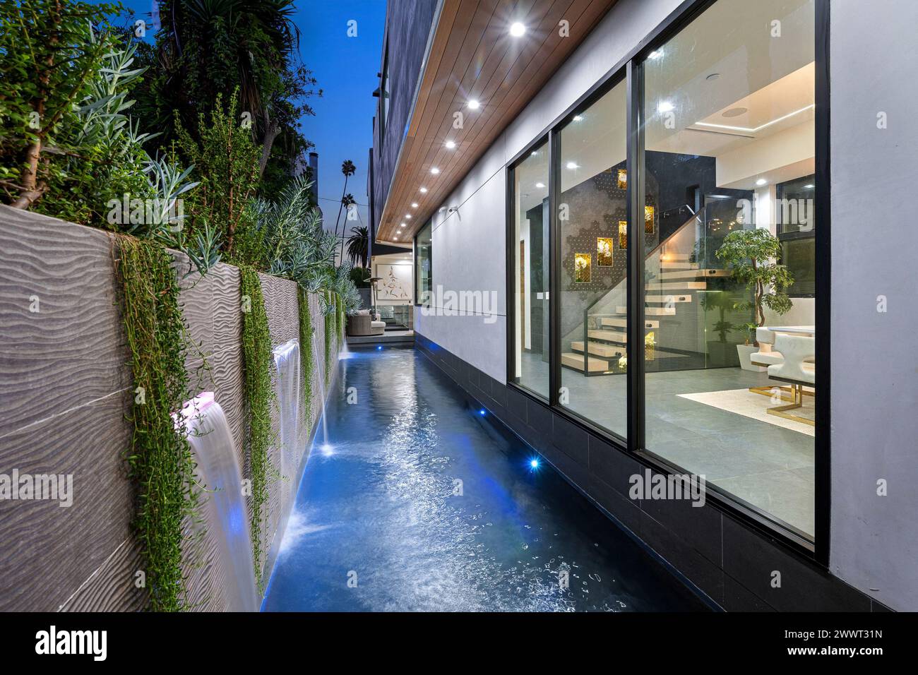 A contemporary residence with a pool in the side yard Stock Photo - Alamy