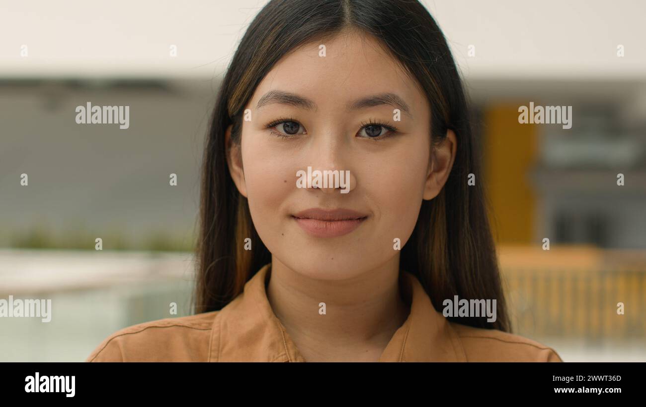 Close up business portrait Asian ethnic girl beautiful calm chinese korean japanese woman ...