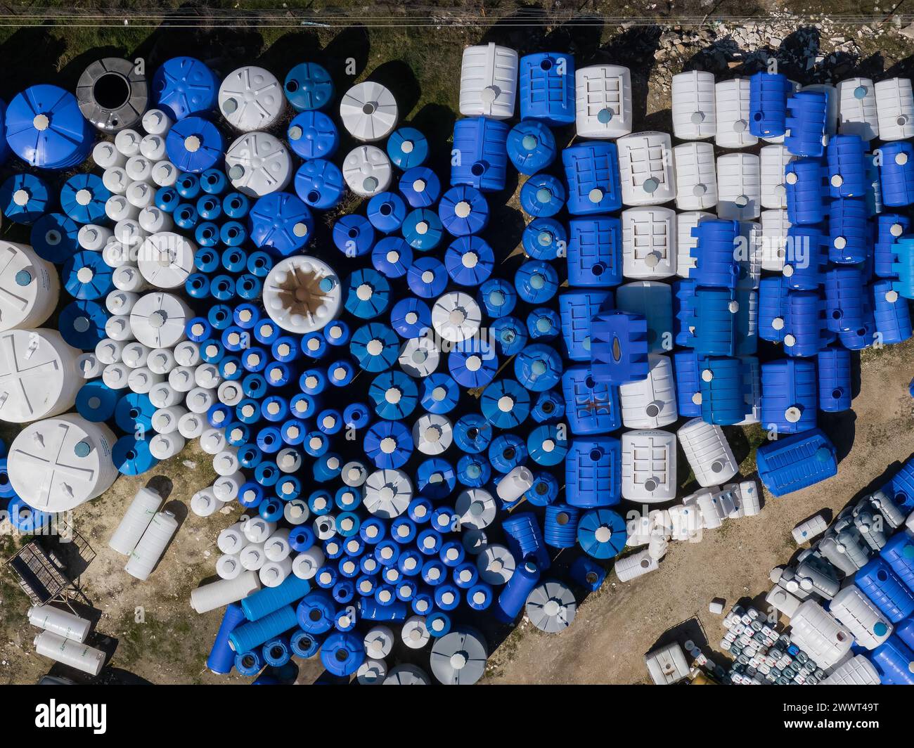Aerial view of polyethylene water tanks in the warehouse of a workplace ...