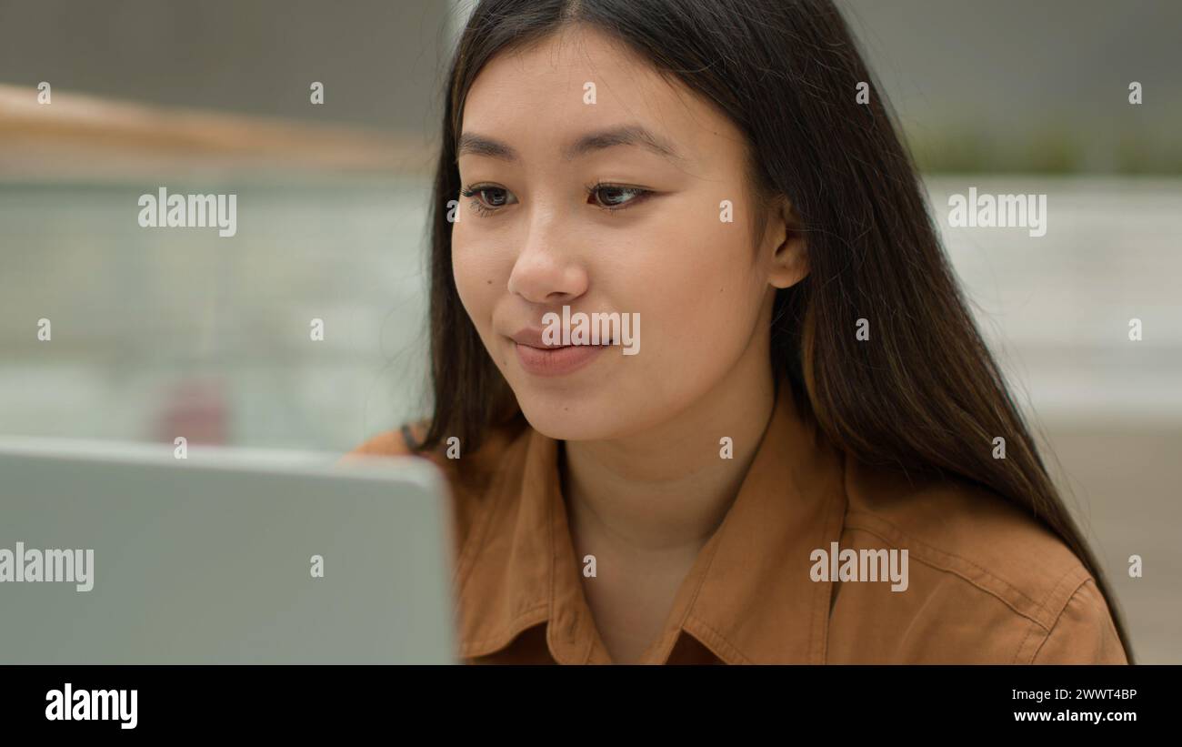 Smiling Asian businesswoman chinese korean japanese multiethnic girl student woman working ...