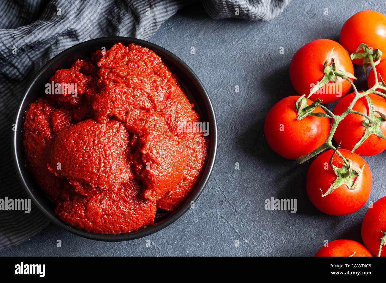 Traditional turkish tomato paste in bowl with fresh tomatoes on rustic ...