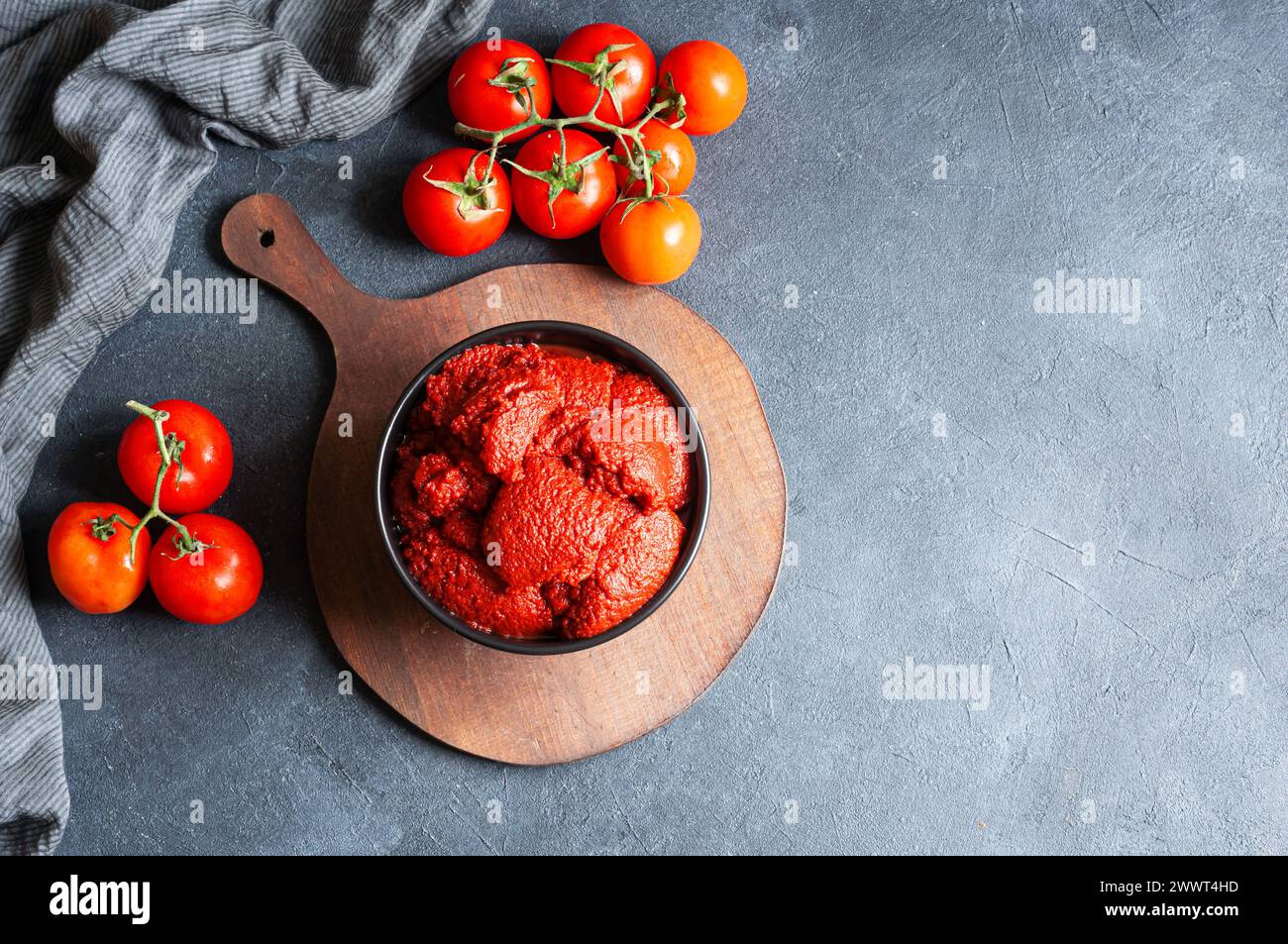 Traditional turkish tomato paste in bowl with fresh tomatoes on rustic ...