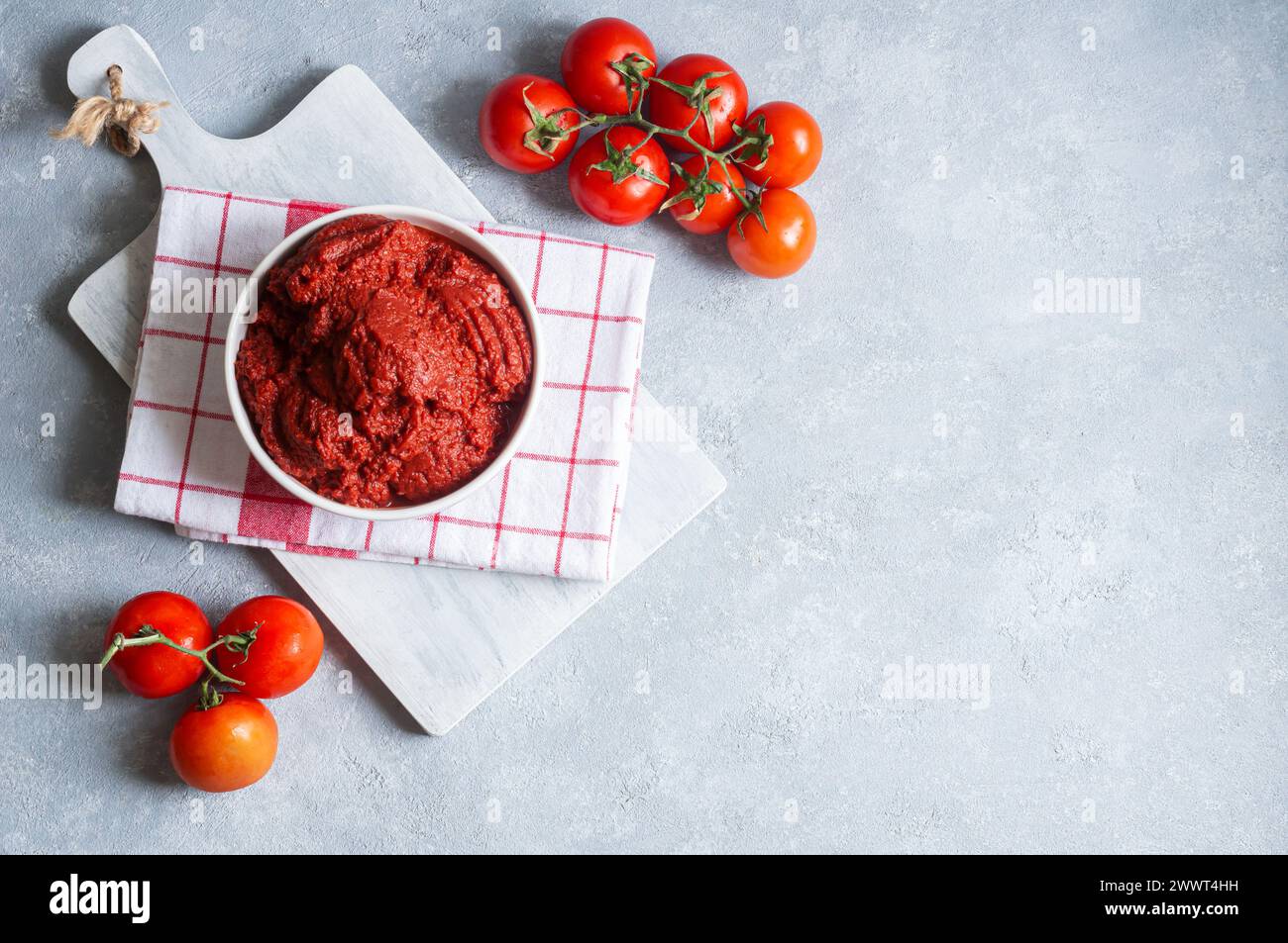Traditional turkish tomato paste in bowl with fresh tomatoes on rustic ...