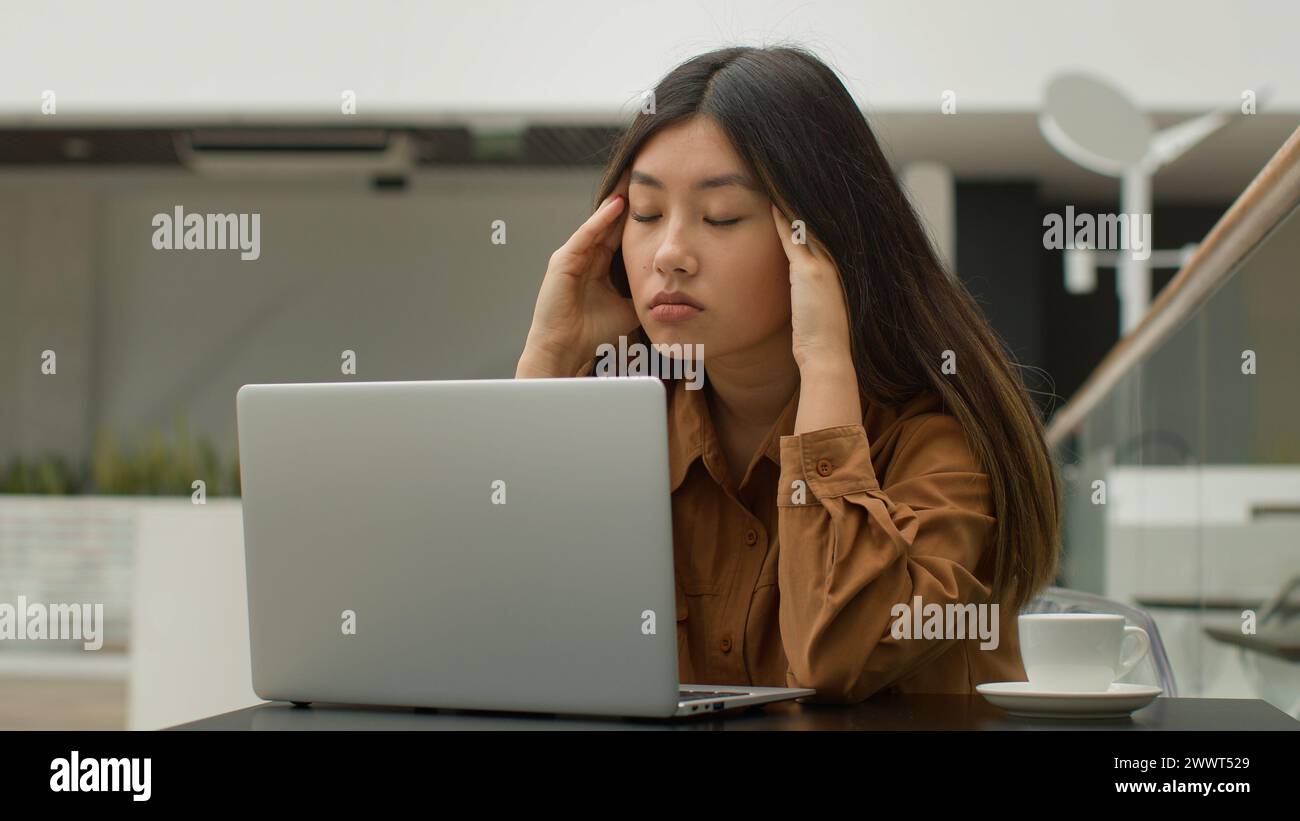 Exhausted overworked Asian chinese japanese woman student girl studying ...