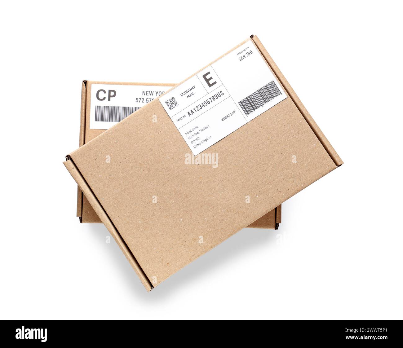 Cardboard packages with shipping labels and barcodes on white ...