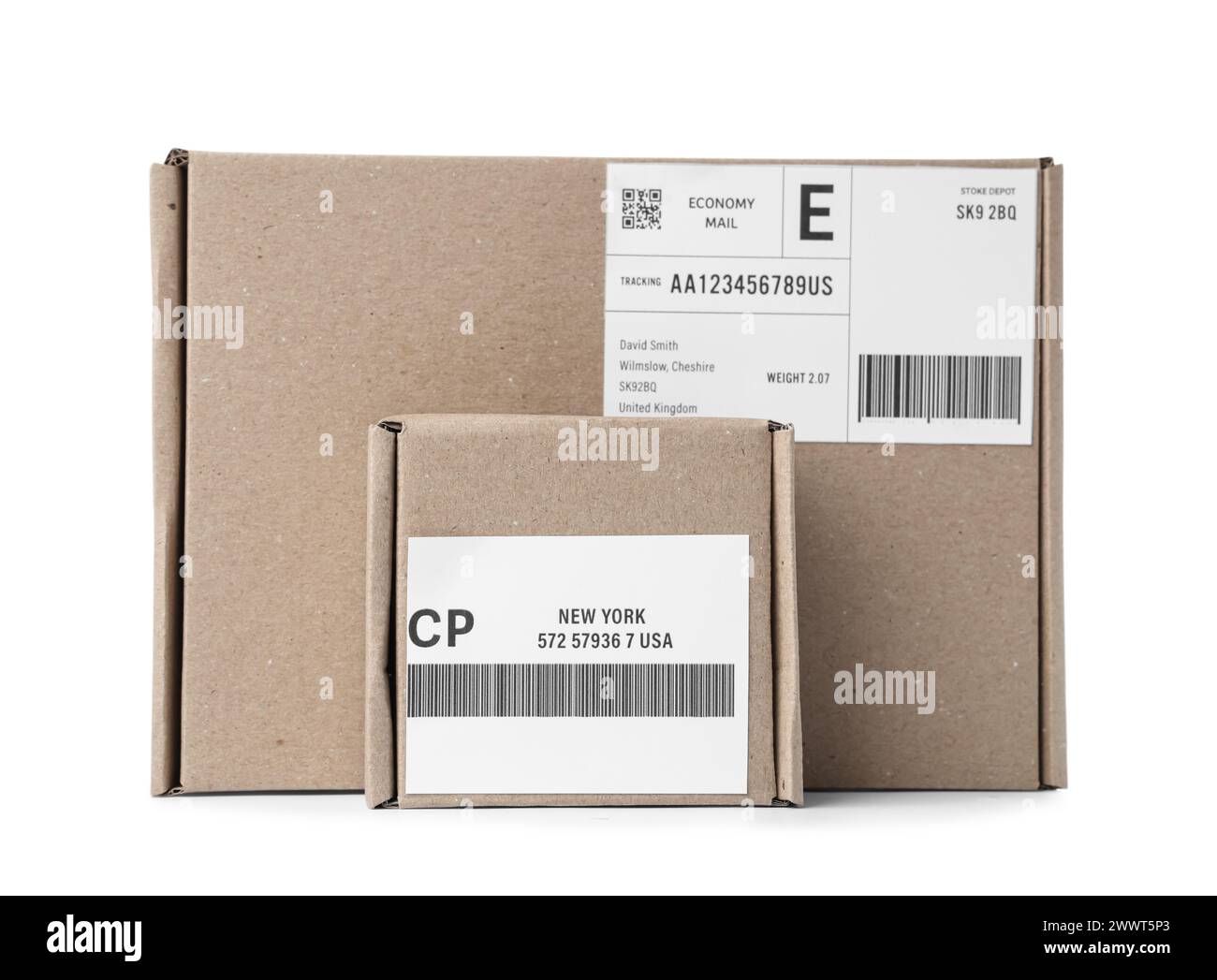 Cardboard packages with shipping labels and barcodes on white ...