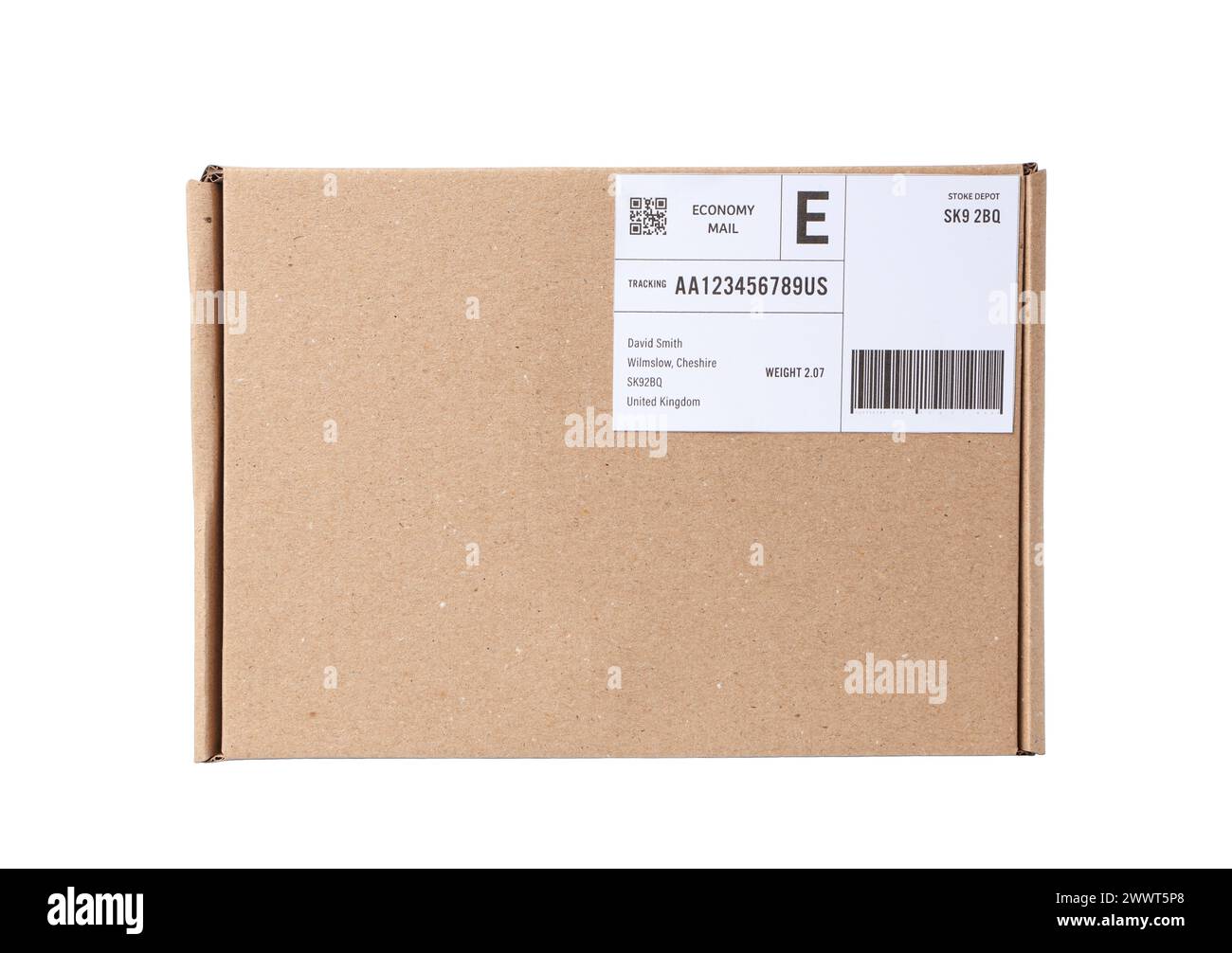Cardboard package with shipping label and barcode on white background ...