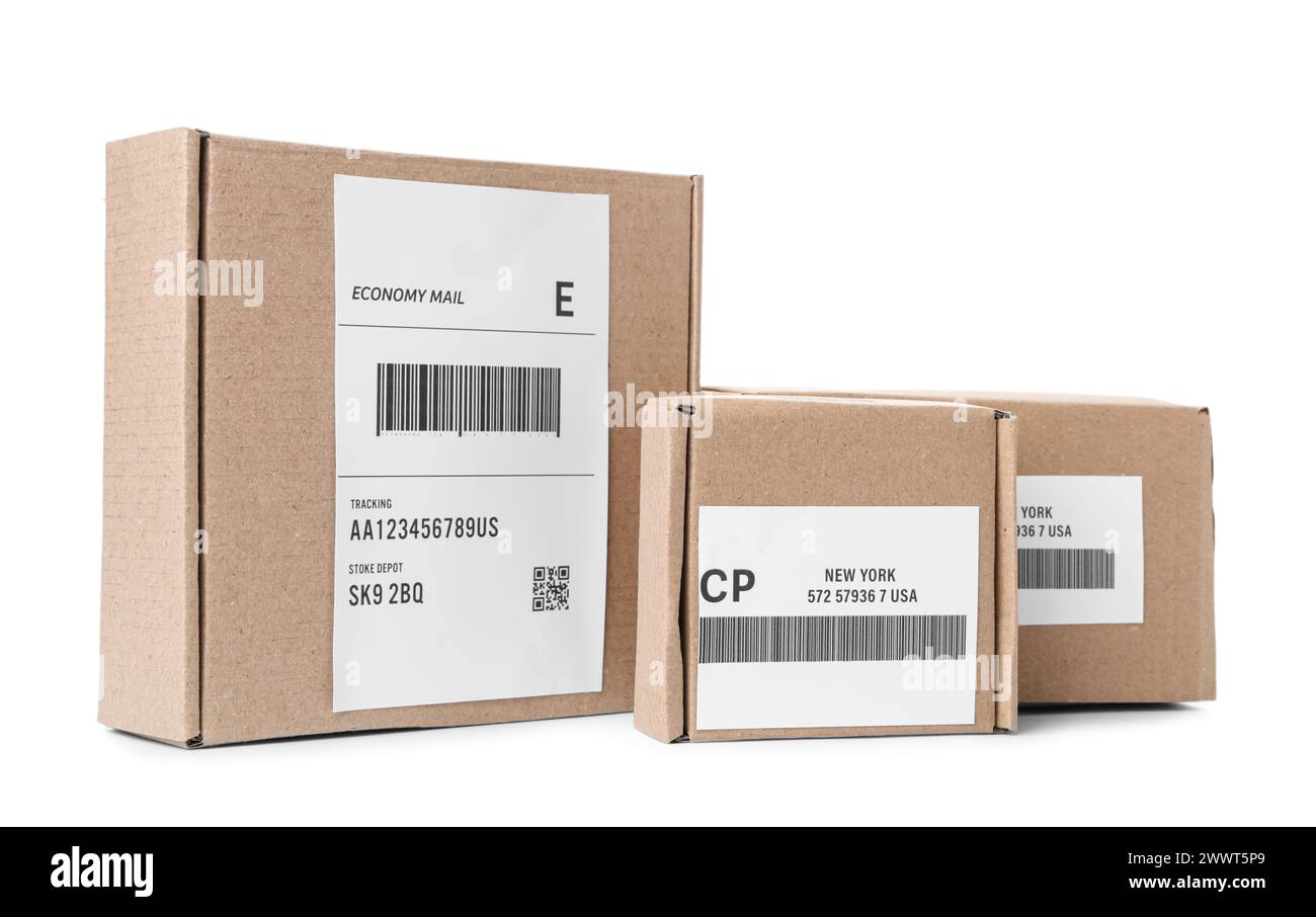 Cardboard packages with shipping labels and barcodes on white ...
