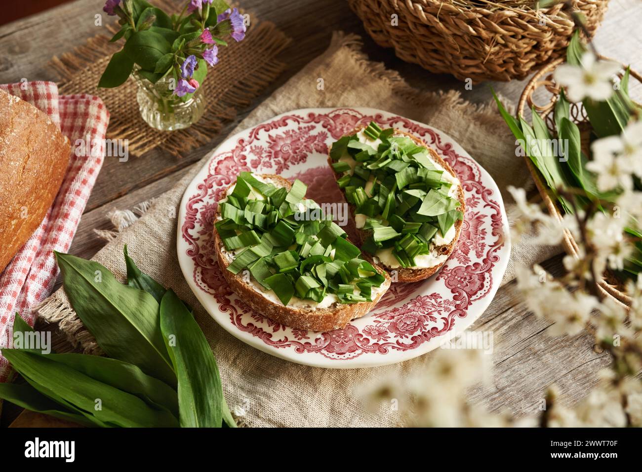 Fresh bear's garlic or ramson leaves on two slices of sourdough bread ...