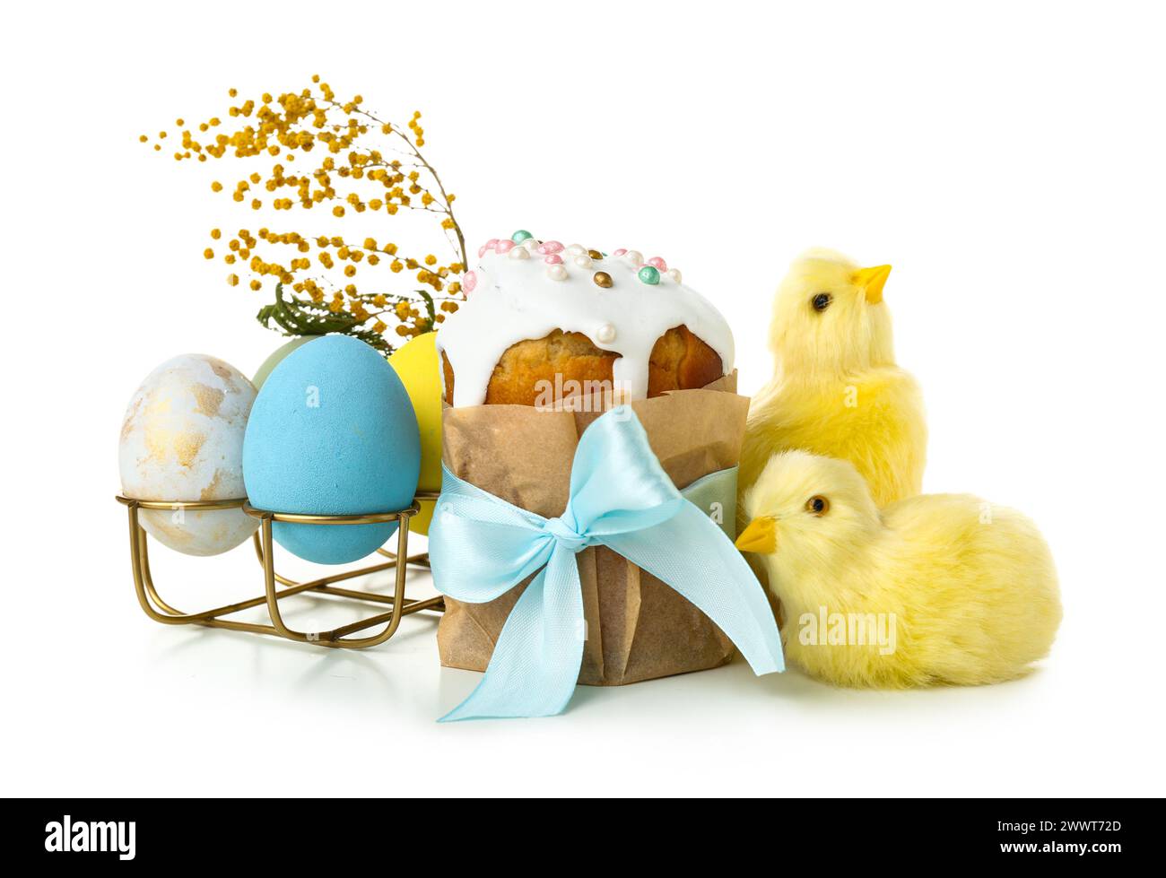 Tasty Easter cake, chicks and holder with eggs on white background ...