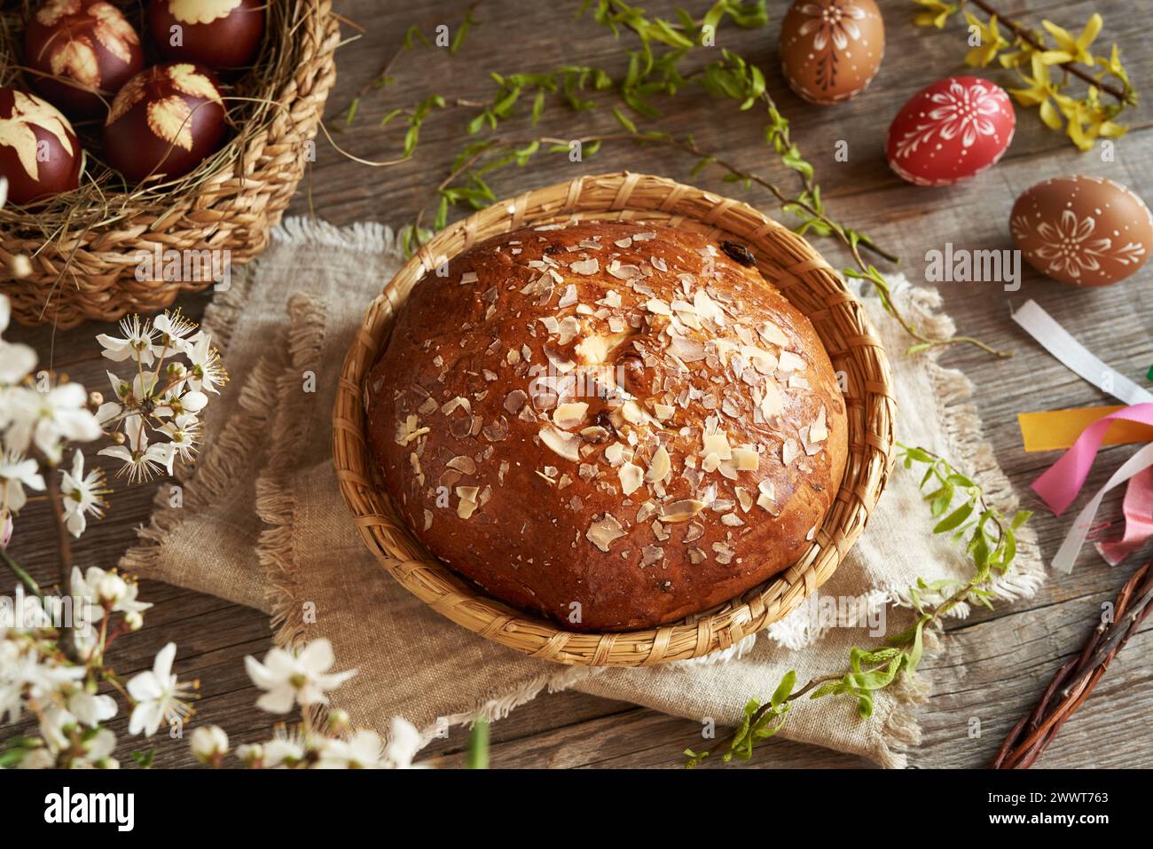 A loaf of Czech sweet Easter cake called mazanec, with eggs dyed with ...