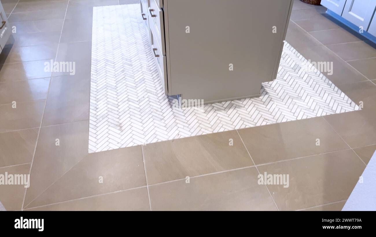 Herringbone Tile Pattern Meets Smooth Tan Flooring Stock Photo - Alamy