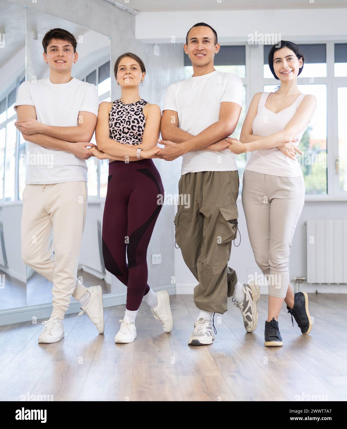 Group of young people stand in row holding hands, performing Irish folk ...