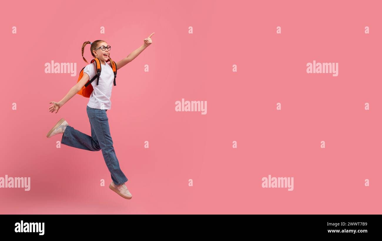 Girl jumping backpack hi-res stock photography and images - Alamy