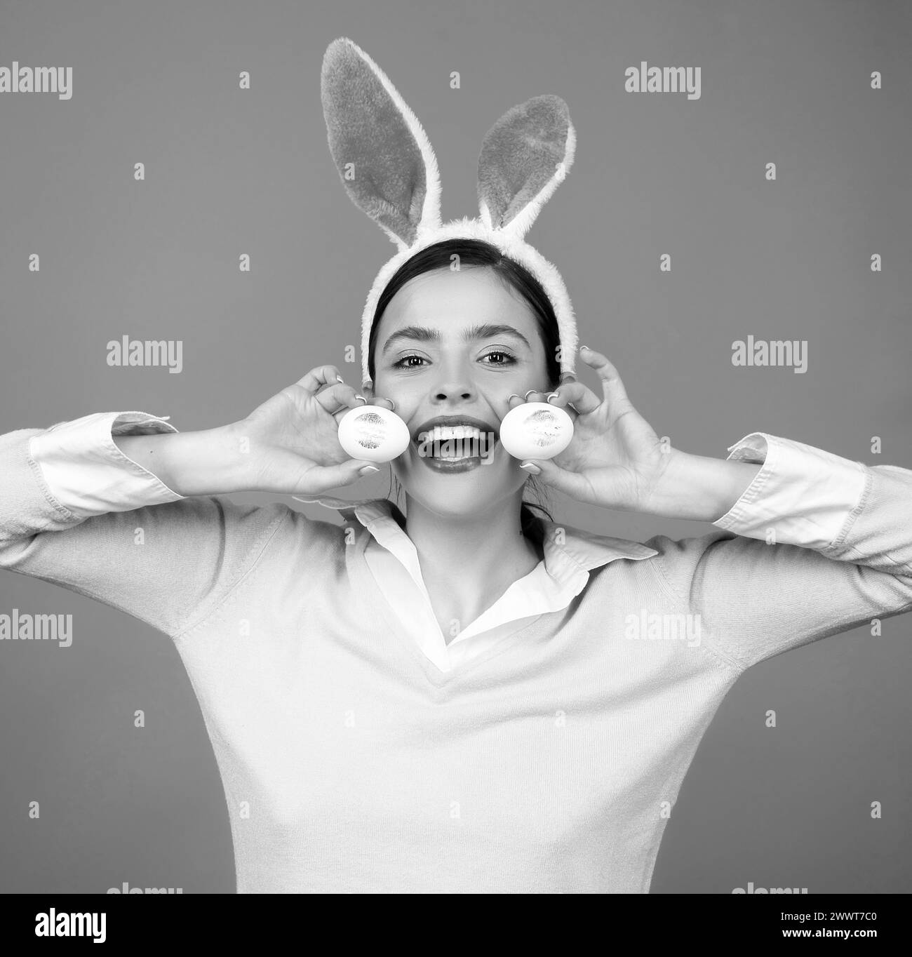 Bunny rabbit girl with easter egg. Woman in rabbit ears. Egg hunt Stock ...