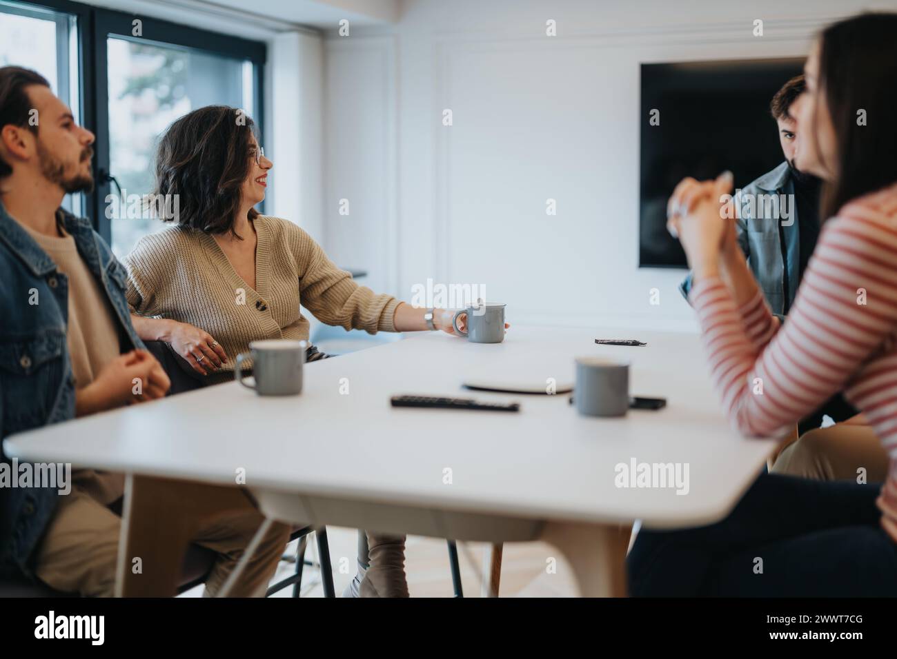 A warm and friendly gathering of friends sharing coffee and good ...