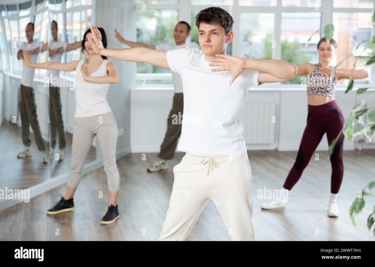 Guy enjoys active dancing, learns new movements, moves synchronously ...