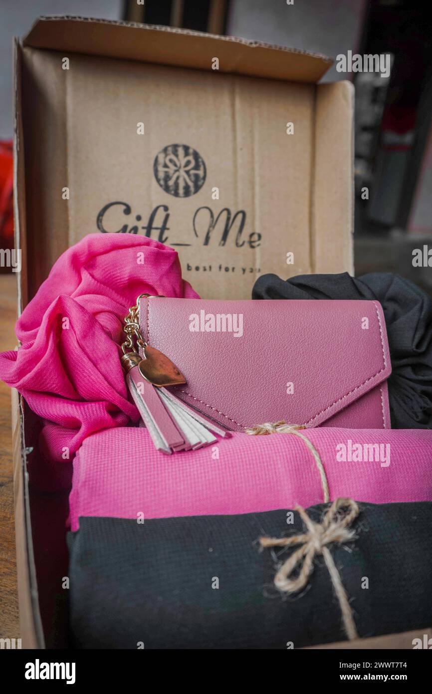 Stock photo of gift box wrapped in craft paper with gold ribbon with ...