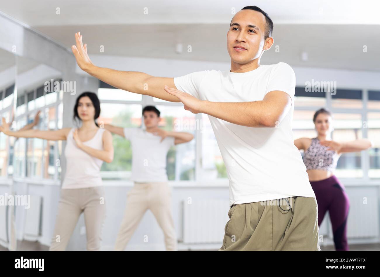 Guy enjoys active dancing, learns new movements, moves synchronously ...