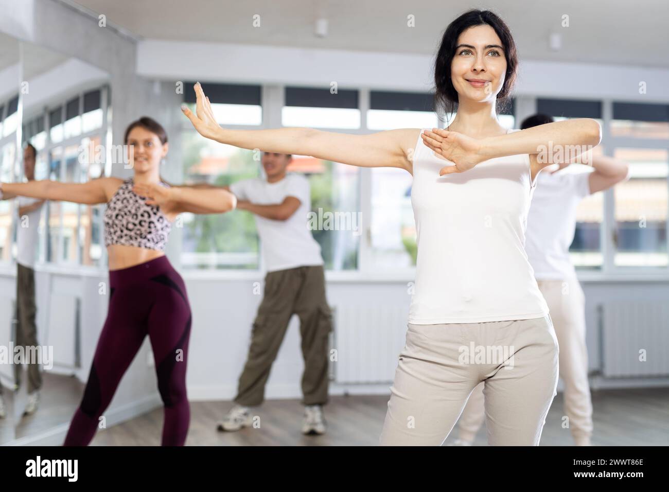 Group of young people warming up before dance class Stock Photo - Alamy
