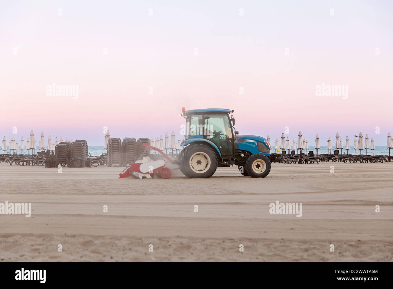 Tractor smoothing sand hi-res stock photography and images - Alamy