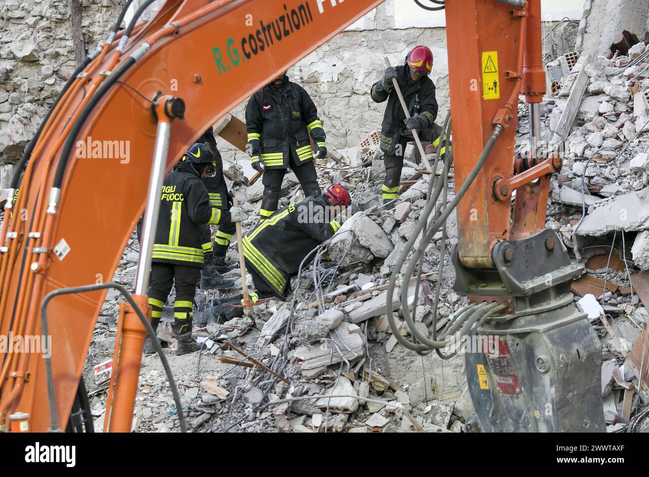 Amatrice, Rieti Italia 08 25 2016 a fireman search rescue in the ruins ...