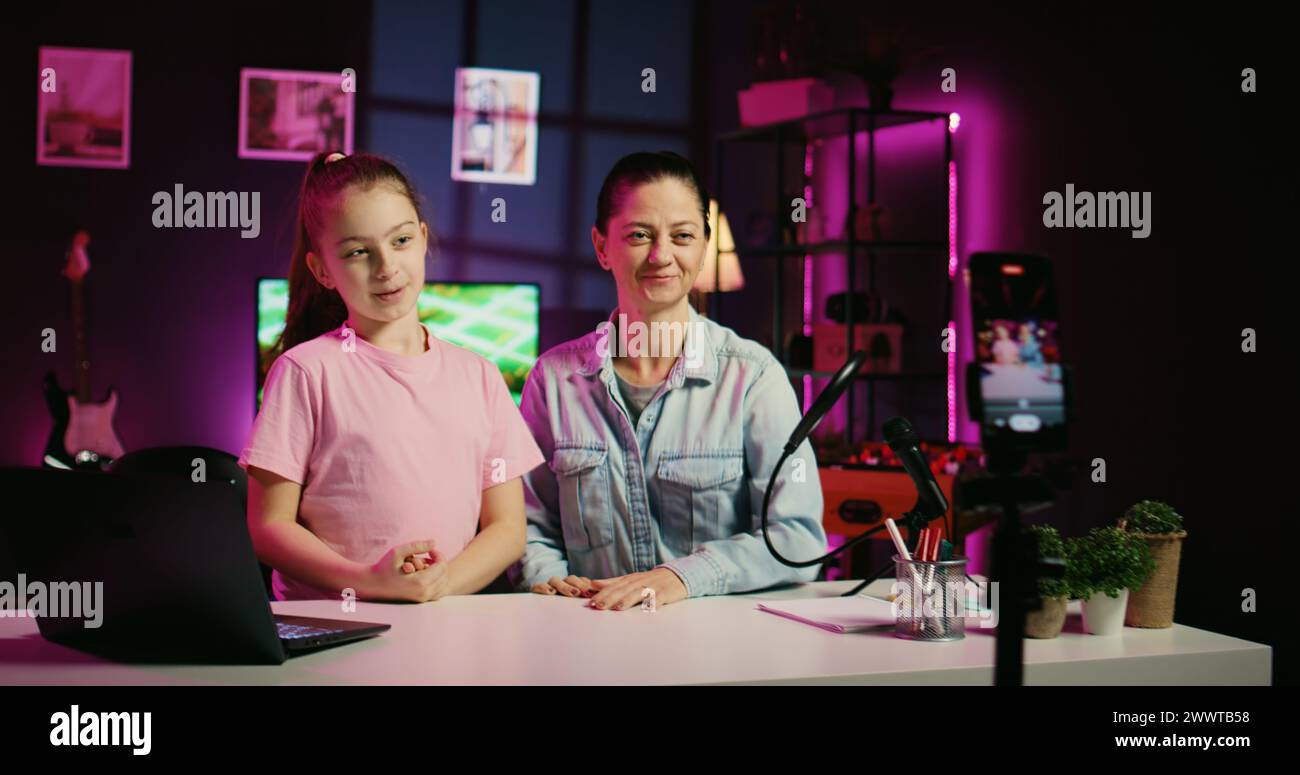 Kid content creator filming technology review of newly released ...