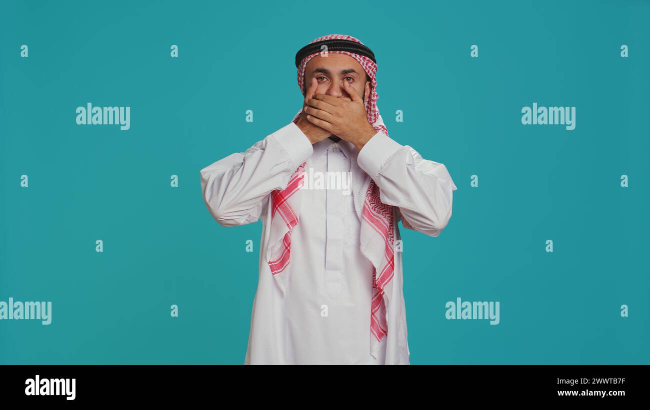 Male model covers eyes, ears and mouth on camera, presenting three wise ...