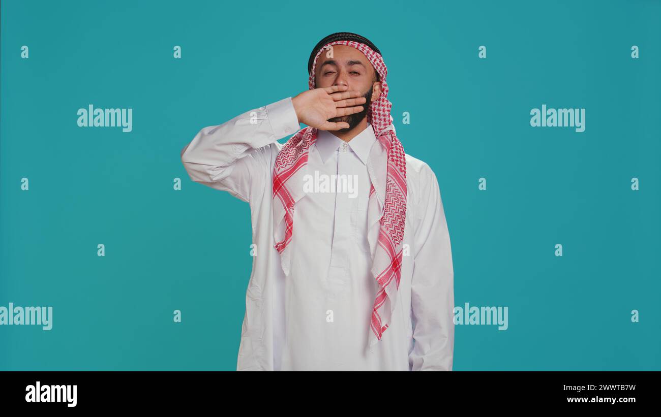 Sleep deprived guy yawning in studio, feeling extremely sleepy and ...