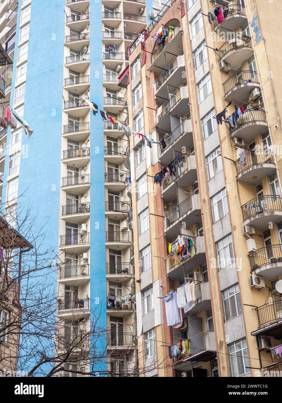 High buildings. Background of windows and balconies. Contrast of a poor ...