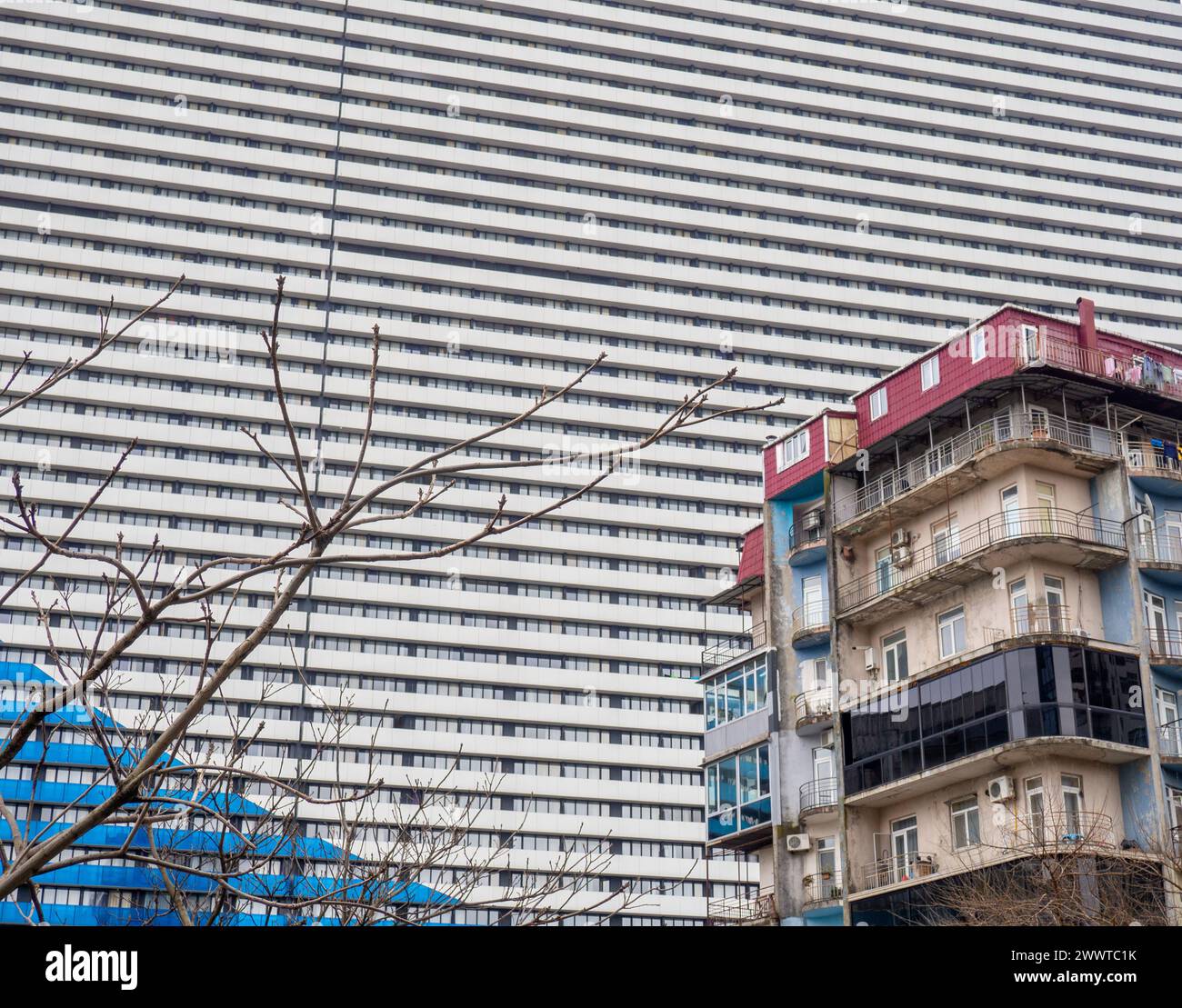 High buildings. Background of windows and balconies. Contrast of a poor ...