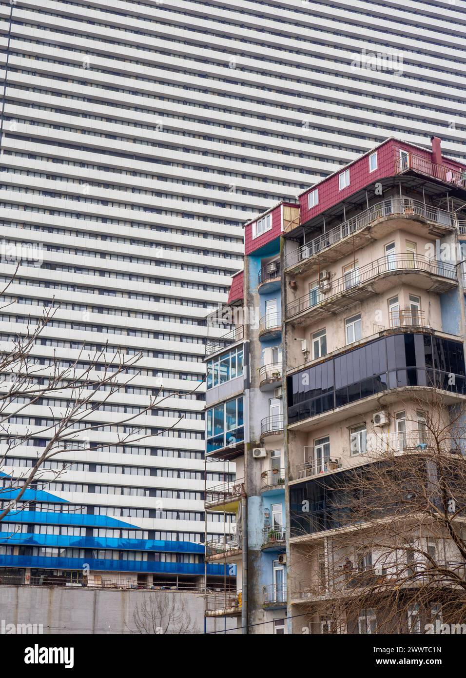 High buildings. Background of windows and balconies. Contrast of a poor ...