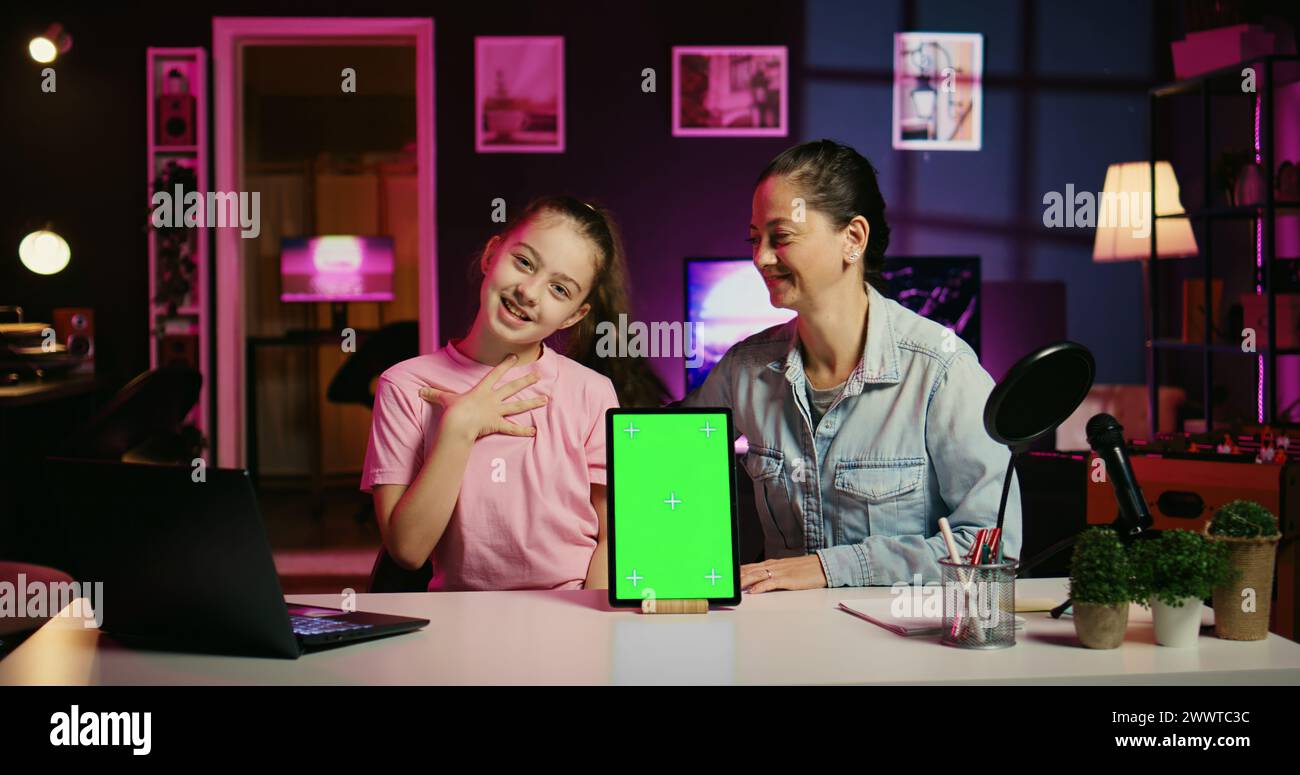 Cute kid filming internet show helped by her mother, promoting green ...