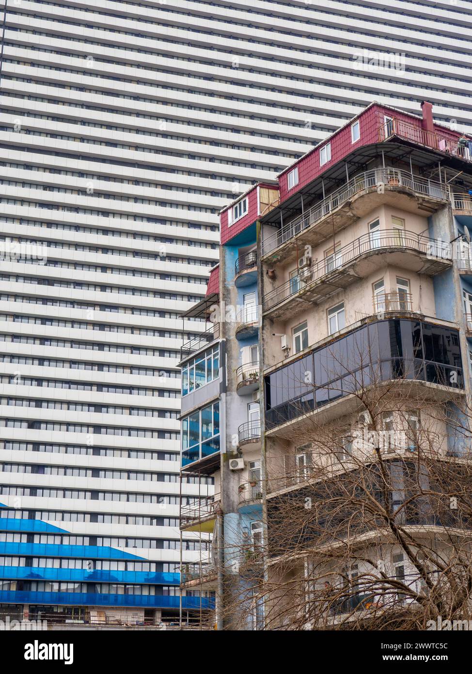High buildings. Background of windows and balconies. Contrast of a poor ...