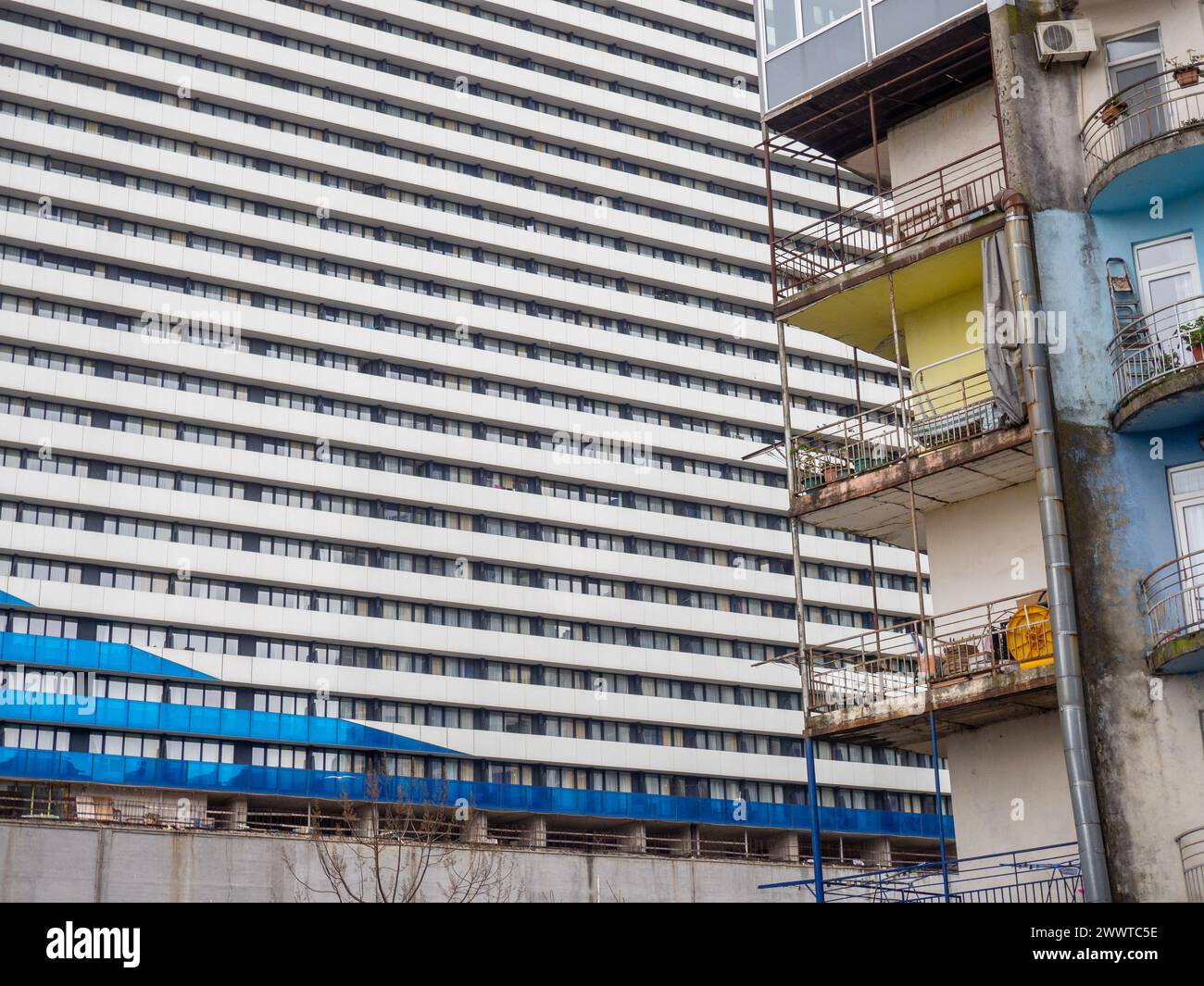 High buildings. Background of windows and balconies. Contrast of a poor ...