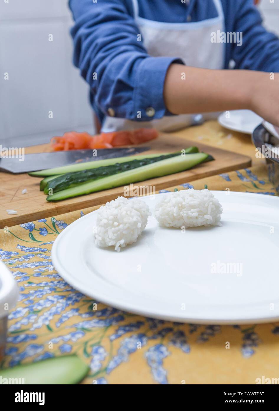 Child boy preparing homemade sushi. Kid-Friendly Kitchen Activities ...