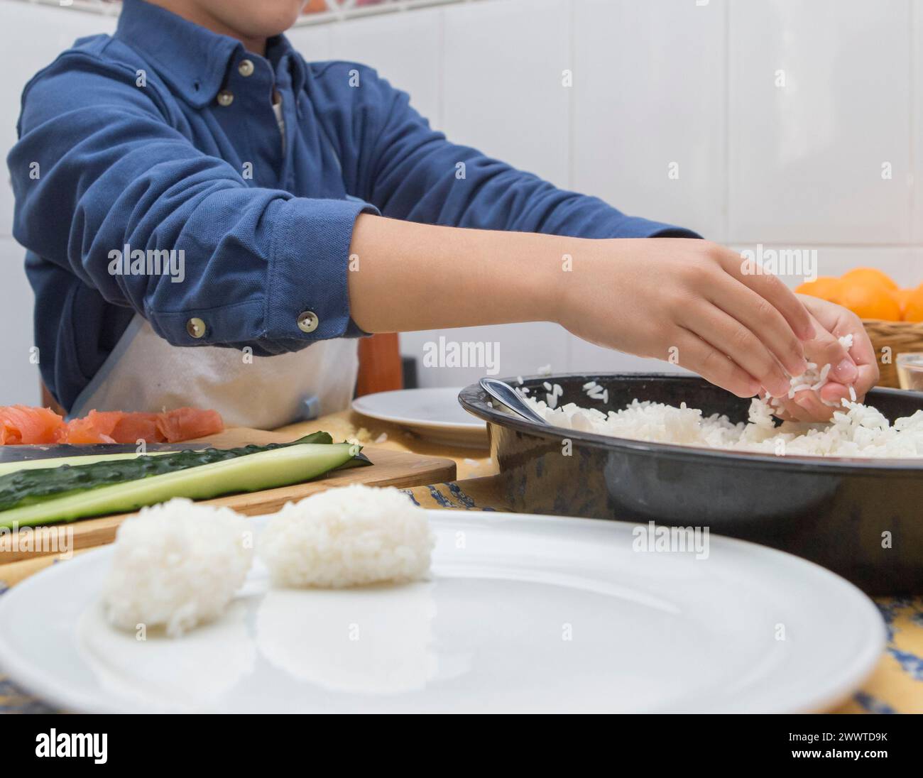 Child boy preparing homemade sushi. Kid-Friendly Kitchen Activities ...