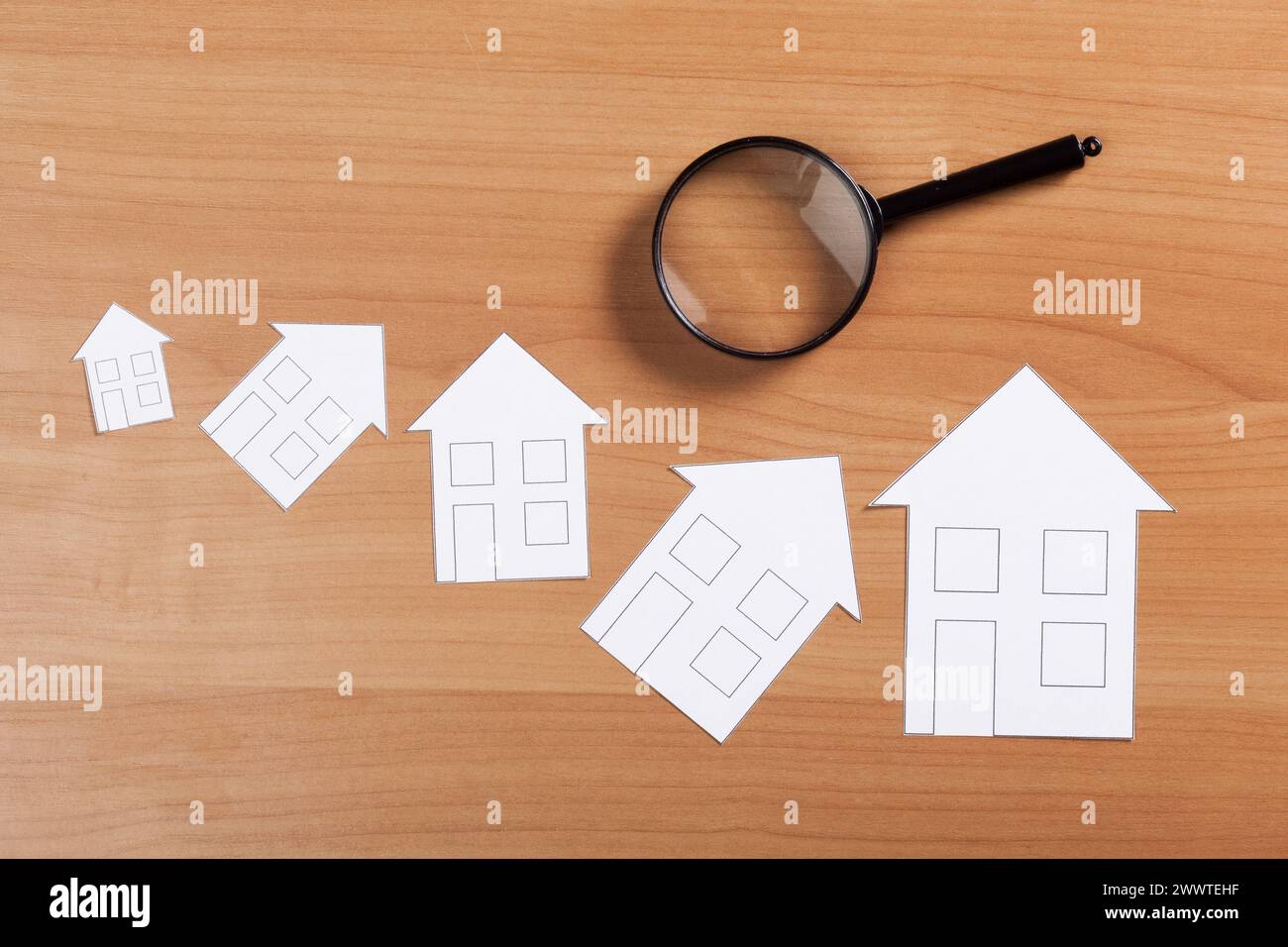 paper house with Magnifying Glass Stock Photo - Alamy