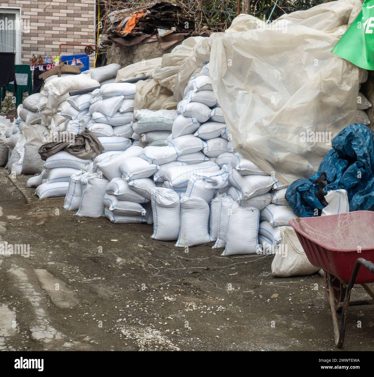 Warehouse in the courtyard of a residential building. Bags with ...