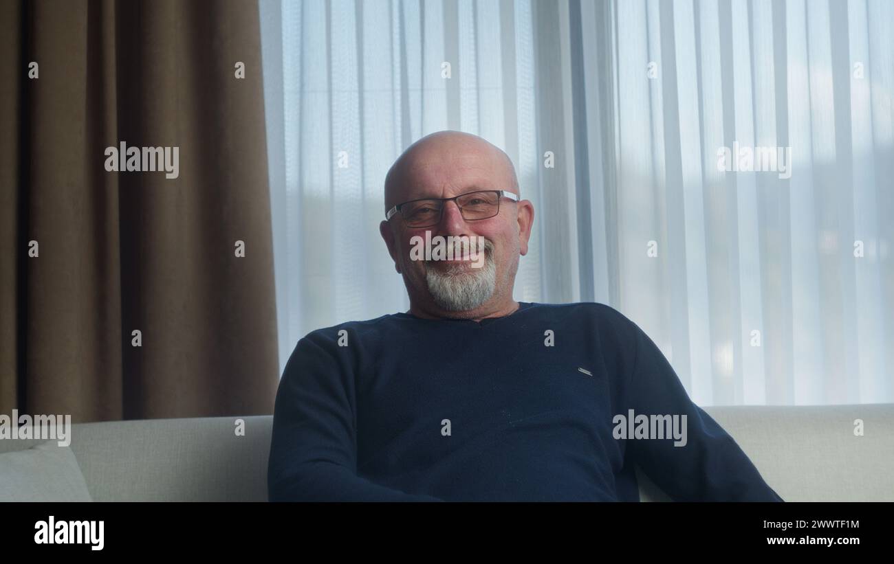 Retired senior man in glasses hi-res stock photography and images - Alamy