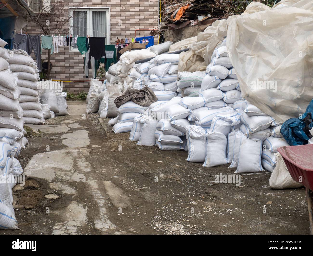 Warehouse in the courtyard of a residential building. Bags with ...