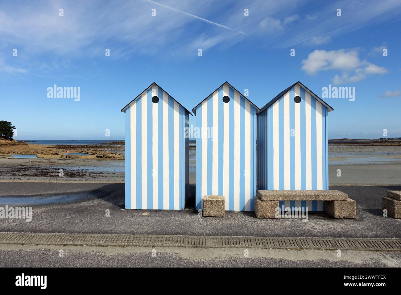 three bathing boxes on the beach at ebb tide, France, Brittany, Saint ...