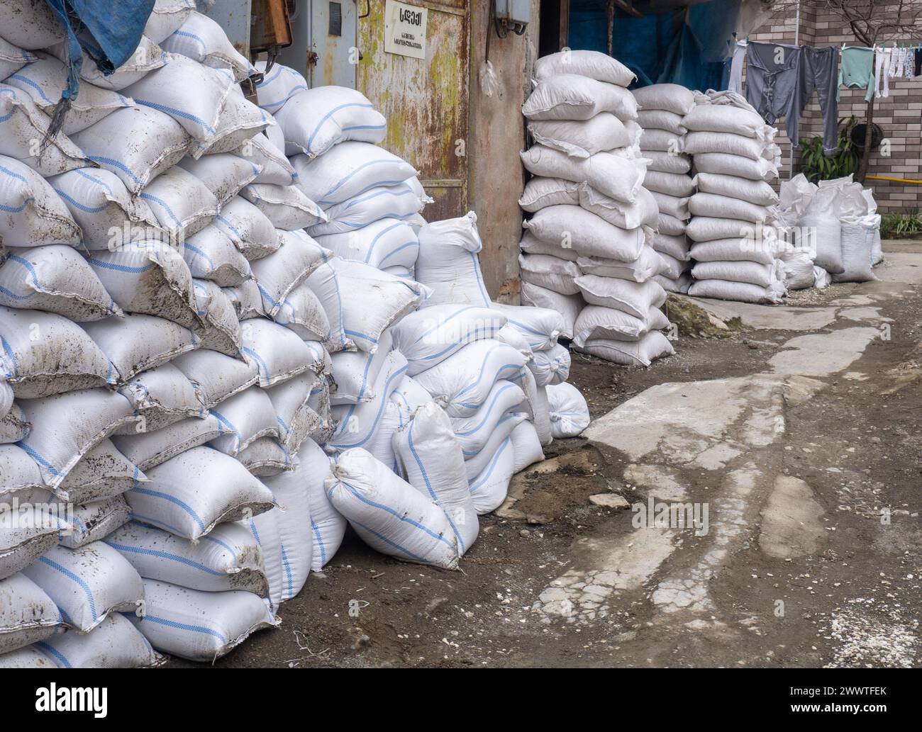 Warehouse in the courtyard of a residential building. Bags with ...