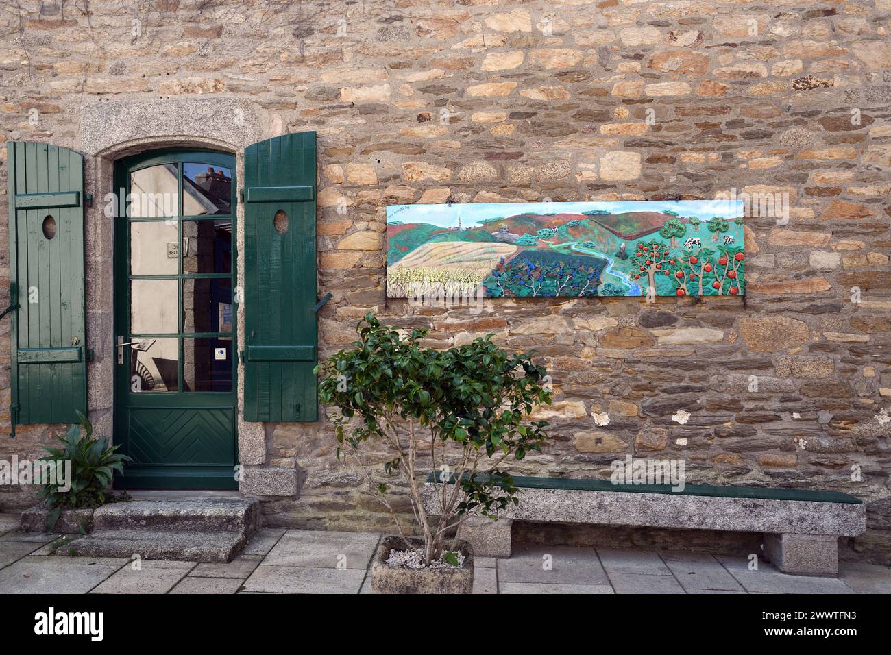 rustic front door with shutters, potted plant, stone bench and glazed ...