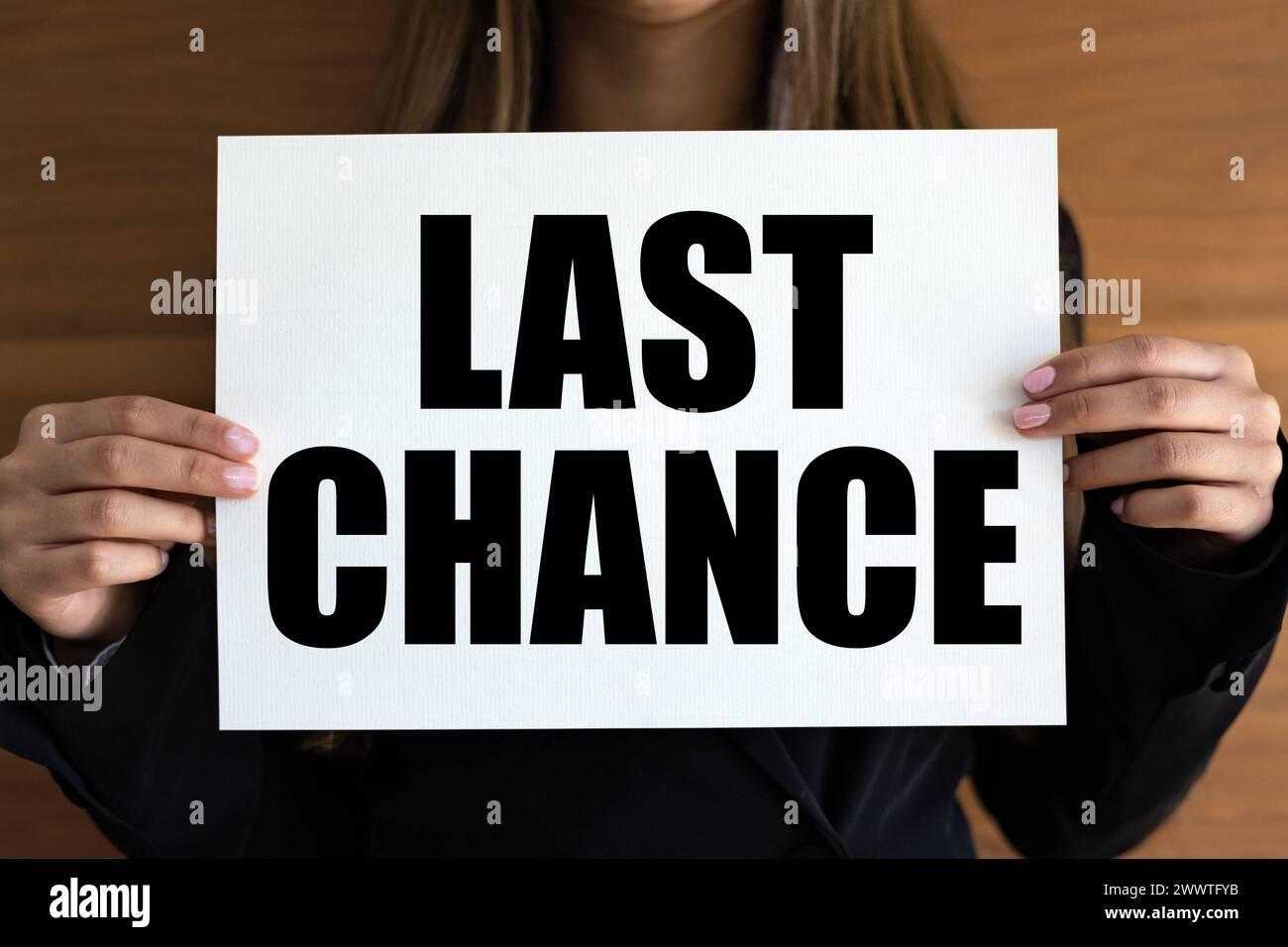 Last Chance Last chance. Woman with white page, black letters ...