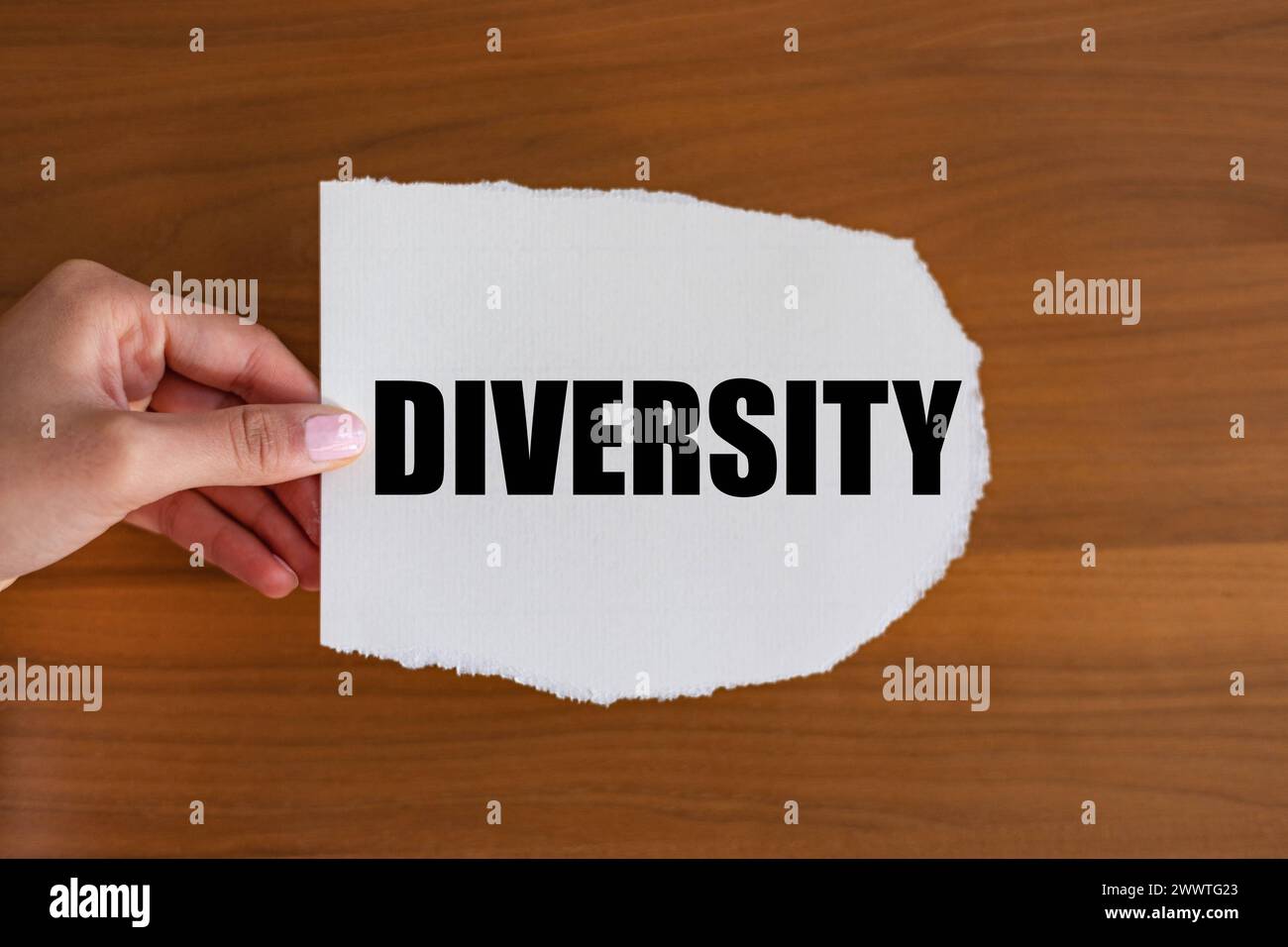 Diversity Diversity. Woman hand holds a piece of paper with a note ...
